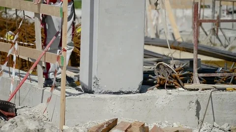 Workers inserting basement pillars on co... | Stock Video | Pond5