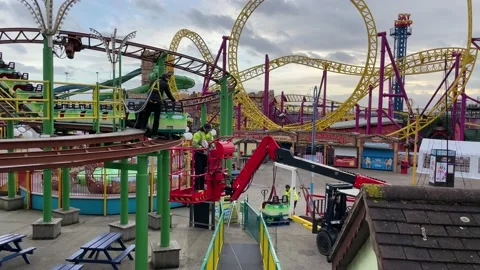 Workers maintaining theme park rides Adv... | Stock Video | Pond5