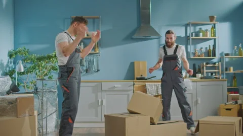 Workers of Moving Company Lose their Bal... | Stock Video | Pond5