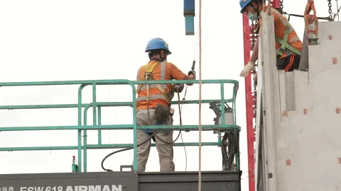 Workers In Safety Gears Get Into An Elev... | Stock Video | Pond5
