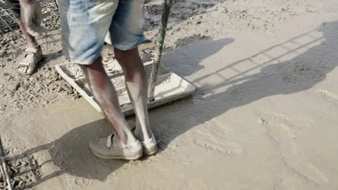 Workers settle and level the concrete in... | Stock Video | Pond5