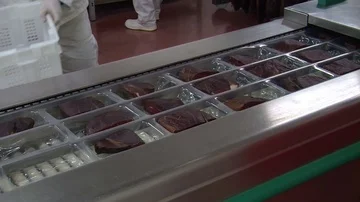 Workers sorting and packing dry meat in ... | Stock Video | Pond5