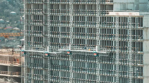 Workers work in a construction cradle, o... | Stock Video | Pond5