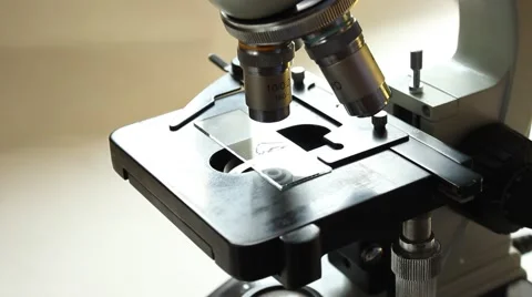 Working with a microscope. Lab microscop... | Stock Video | Pond5