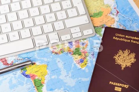 World's map with keyboard, passport and pen ~ Premium Photo #74062484