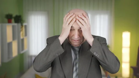 Worried old man at home is afraid and su... | Stock Video | Pond5