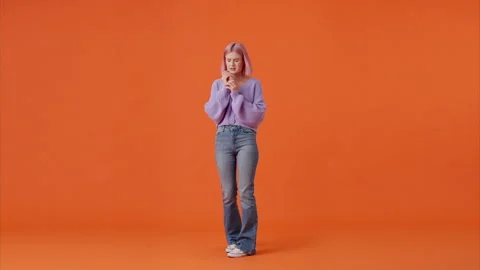 Worried woman nervously walking over ora... | Stock Video | Pond5