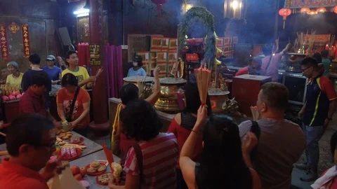 Worshiper inside Thai Pak Koong Temple T... | Stock Video | Pond5