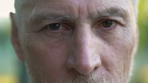 Wrinkled retired man smiling and looking... | Stock Video | Pond5