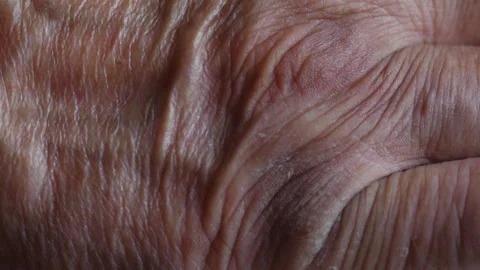 wrinkled skin of the hands of an elderly... | Stock Video | Pond5