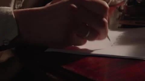 Writer takes notes on a paper in a dark ... | Stock Video | Pond5