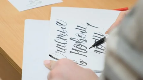 Writing letters in copy sheet paper with... | Stock Video | Pond5