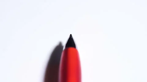 Writing pen rotates on white background | Stock Video | Pond5