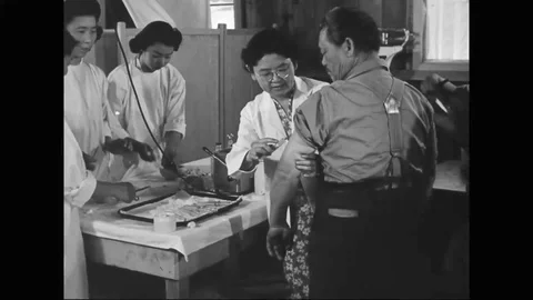 WW2 1942 USA - Japanese get injection in... | Stock Video | Pond5
