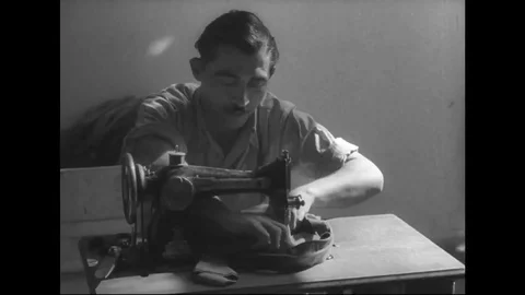 WW2 - Man work on sewing machine | Stock Video | Pond5