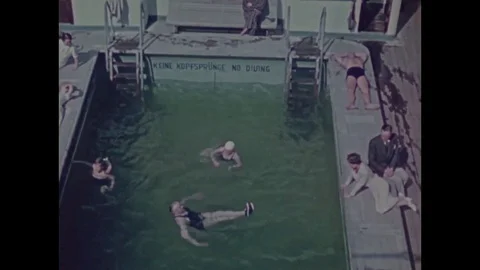 WW2 - People swim in swimming pool on sh... | Stock Video | Pond5