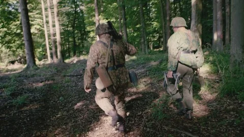 WW2 – Two german soldiers walking in f... | Stock Video | Pond5