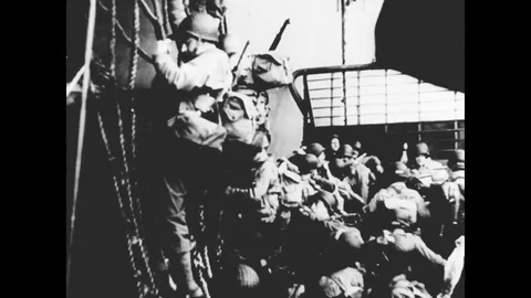 WW2 - US soldiers climb in infantry land... | Stock Video | Pond5