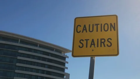 Yellow Caution Stairs warning sign | Stock Video | Pond5