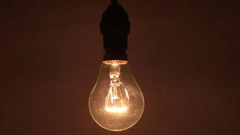 yellow color filament light bulb on blac... | Stock Video | Pond5