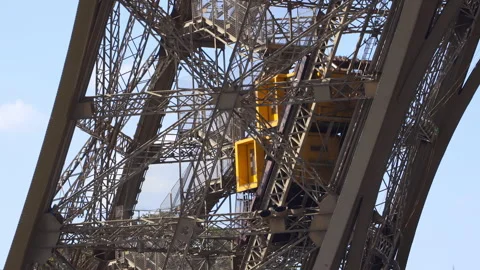 Yellow elevator going down in the Eiffel... | Stock Video | Pond5