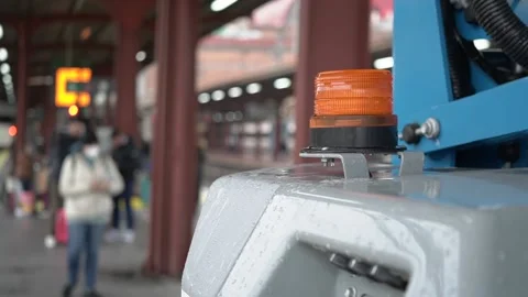 Yellow emergency flasher with people in ... | Stock Video | Pond5