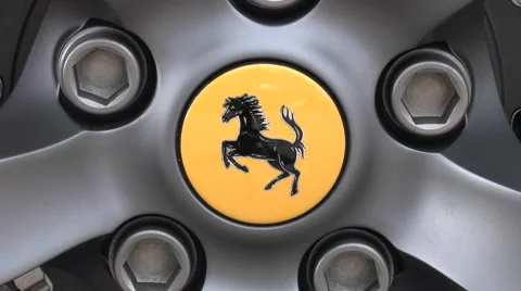Yellow Ferrari logo on a wheel. | Stock Video | Pond5