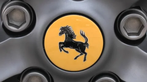 Yellow Ferrari logo on a wheel. | Stock Video | Pond5