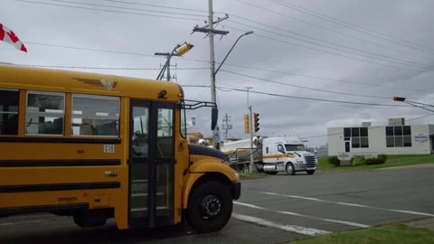 Yellow school bus passes an intersection... | Stock Video | Pond5