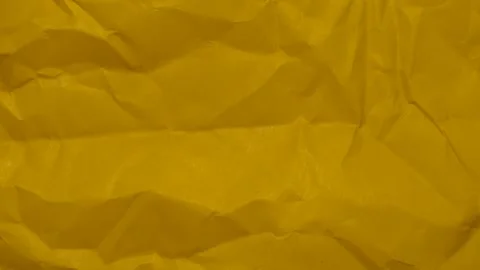 yellow sheet of paper with visible textu... | Stock Video | Pond5