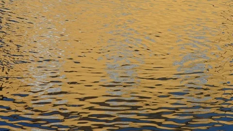 Yellow sparkling water surface with smal... | Stock Video | Pond5