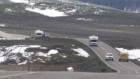 Yellow tour bus in yellowstone National ... | Stock Video | Pond5