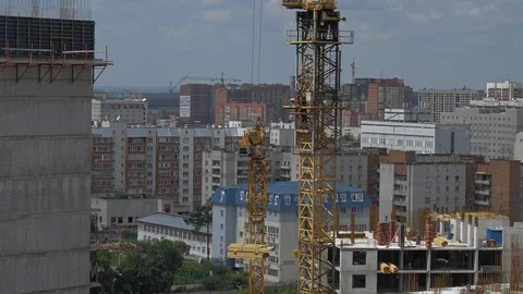 Yellow Tower Building Crane lift cargo o... | Stock Video | Pond5