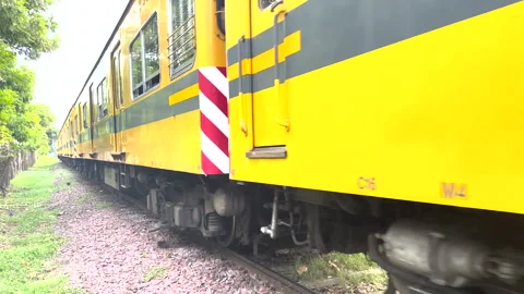 Yellow train rides on the railway tracks... | Stock Video | Pond5