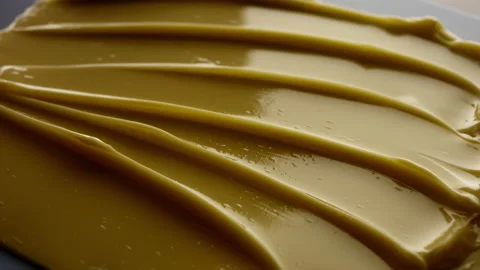 Yellow wax texture on white background w... | Stock Video | Pond5