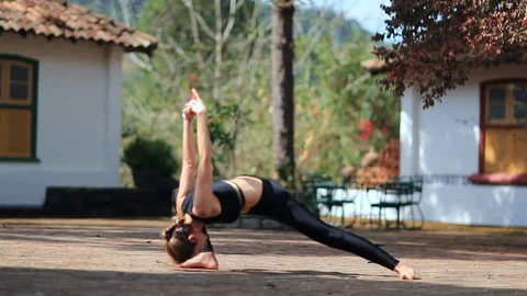 Yogi woman training asana poses outdoors | Stock Video | Pond5