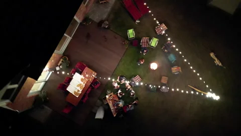 Young adults enjoying a garden party, fa... | Stock Video | Pond5