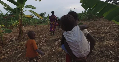 Young African children run In in open la... | Stock Video | Pond5