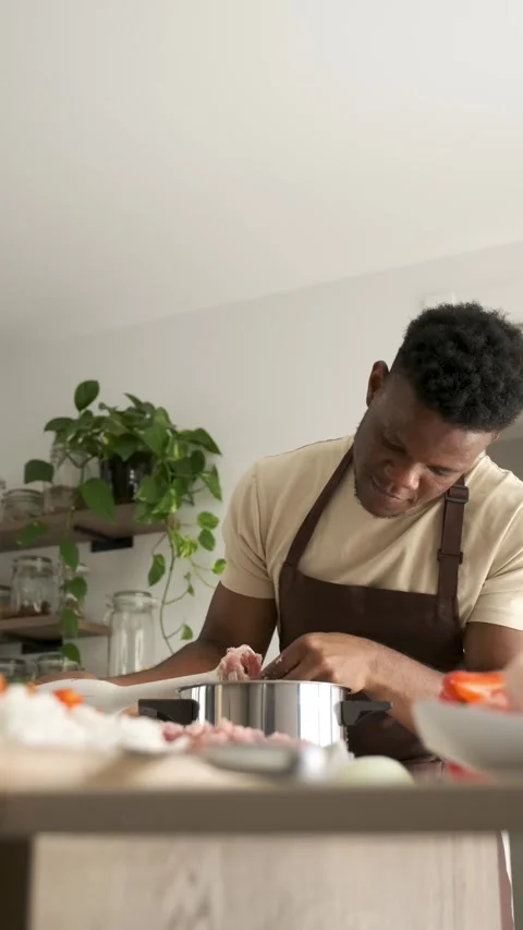 Young african man using a blender to pre... | Stock Video | Pond5