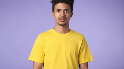 Young african scared guy isolated over p... | Stock Video | Pond5