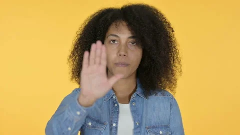 Young African Woman Stop Sign by Hand, Y... | Stock Video | Pond5