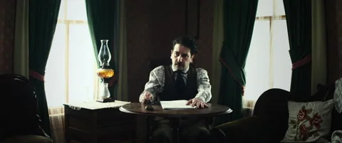 Young Albert Einstein thinking at table ... | Stock Video | Pond5