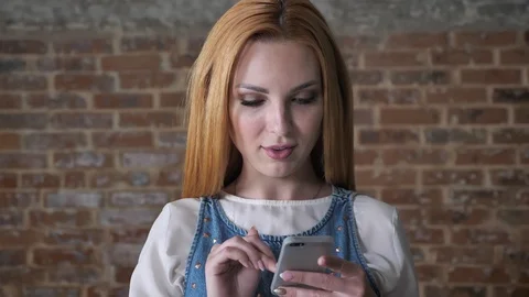 Young alluring blond girl is typing mess... | Stock Video | Pond5