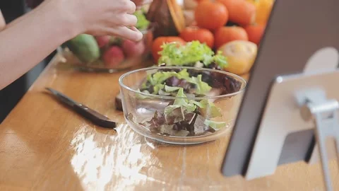 Young and happy woman eating healthy sal... | Stock Video | Pond5