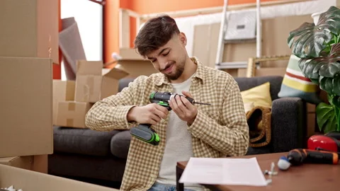 Young arab man repairing table using dri... | Stock Video | Pond5
