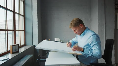 Young architect drawing construction pla... | Stock Video | Pond5