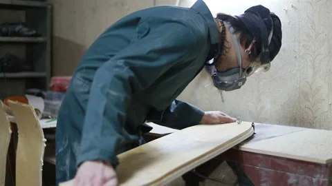 Young artisan man sandering the deck wit... | Stock Video | Pond5