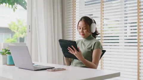 Young asia beautiful female happy WFH ea... | Stock Video | Pond5