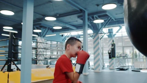 Young asian boy in boxing gloves with a ... | Stock Video | Pond5