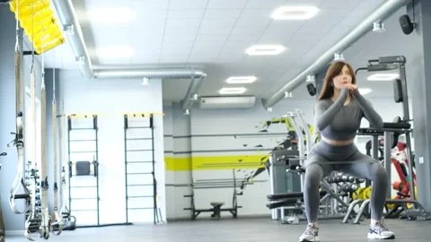 Young Asian girl trains her leg muscles ... | Stock Video | Pond5